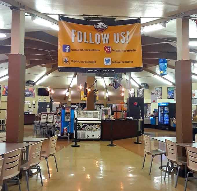 The concession hub beckons with promises of buttery popcorn and treats your cardiologist doesn't need to know about.