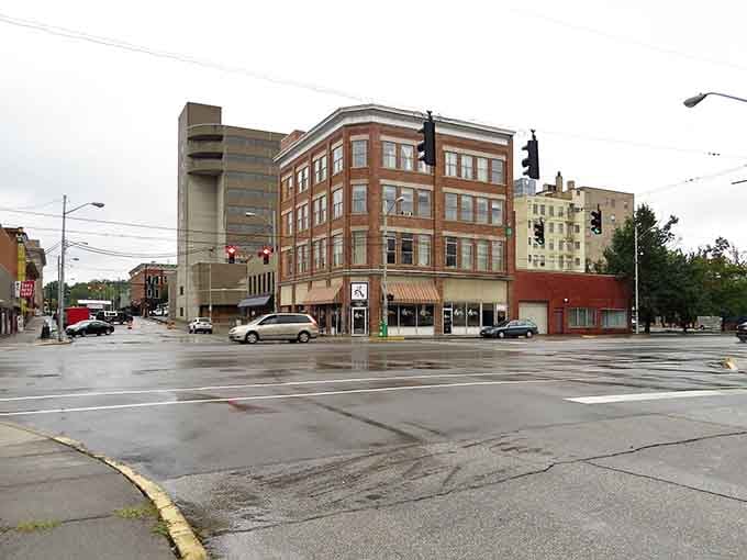 Rain-slicked streets reflect a downtown that knows how to weather any storm with quiet dignity and grace.