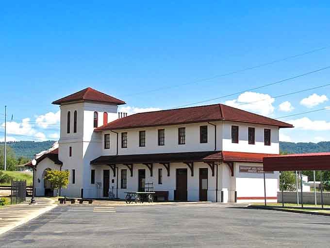 The Spanish Mission-style architecture creates an unexpected visual treat against those rolling mountain backdrops beyond.