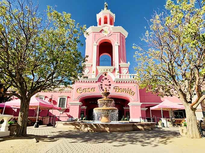 That pink tower rising above the trees signals you've arrived at a restaurant that's part dinner theater, part fever dream.