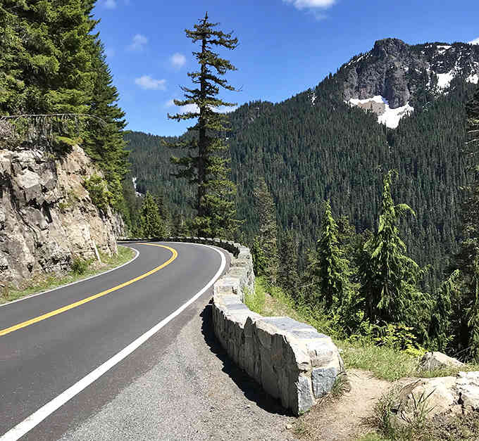 This winding mountain road carved into the cliffs is what driving dreams are made of, pure and simple.
