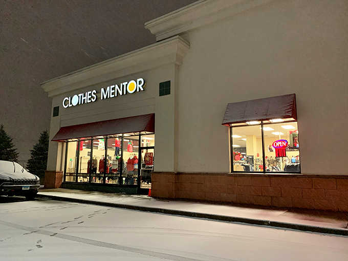 Evening lights glow warmly through windows displaying fashion finds that won't require a second mortgage payment.