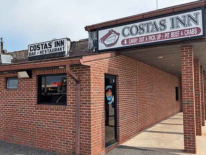 That brick exterior with corner entrance practically whispers "authentic neighborhood spot" where locals gather for serious seafood.