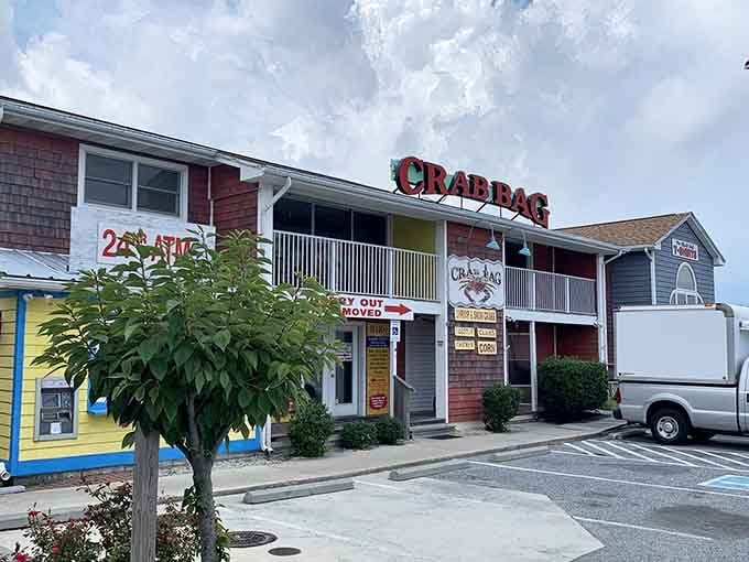 The bright red and green exterior practically shouts "beach town fun" before you even taste your first crab.