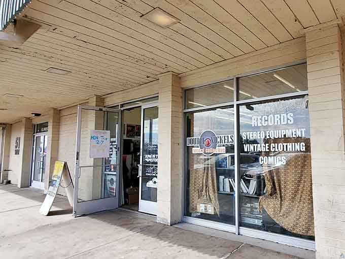 That storefront window displays vinyl like a museum showcases priceless art, because honestly, isn't great music exactly that?