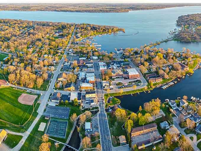 The autumn colors embracing this lakeside town from above look like nature decided to show off just for you.