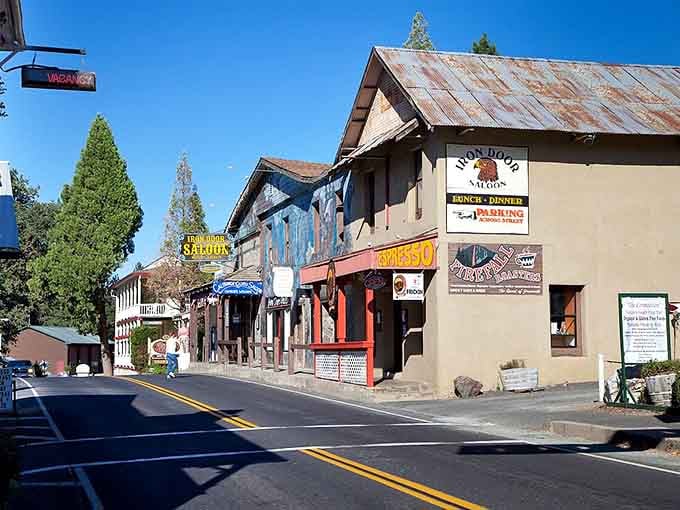 Weathered wood and mountain murals tell stories of miners and dreamers who built this charming Gold Rush gateway.