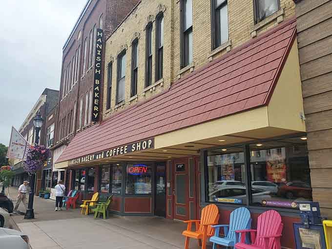 Historic downtown charm meets fresh-baked goodness, with colorful chairs inviting you to stay and enjoy the moment.