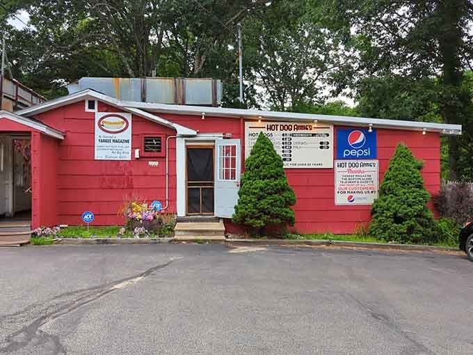 Hot Dog Annie's cozy red shack with trimmed shrubs shows pride in serving straightforward, honest comfort food daily.
