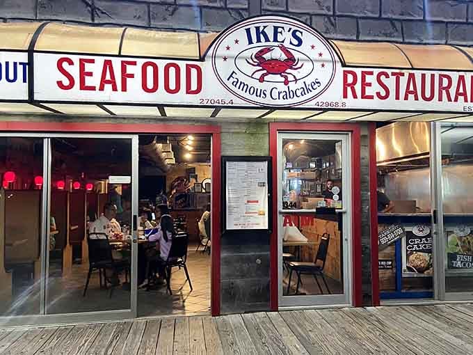 That red crab logo on the boardwalk means one thing: famous crabcakes packed with sweet meat await inside.
