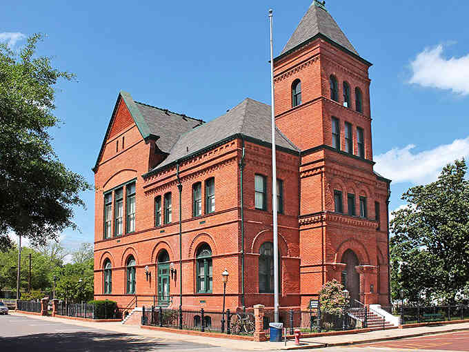 Red brick Victorian beauty rising like a castle, proving small towns built big dreams back then.