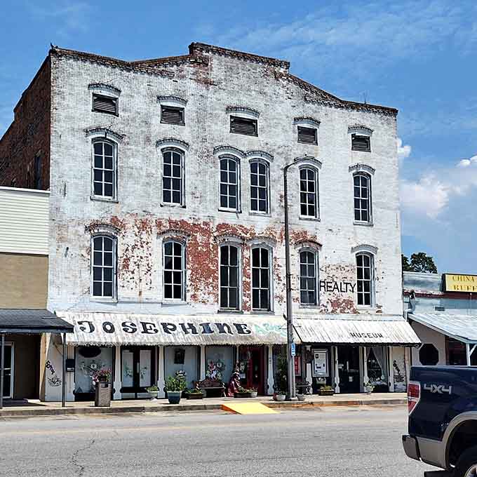 Weathered white brick and arched windows give this building the kind of character Hollywood set designers dream about.