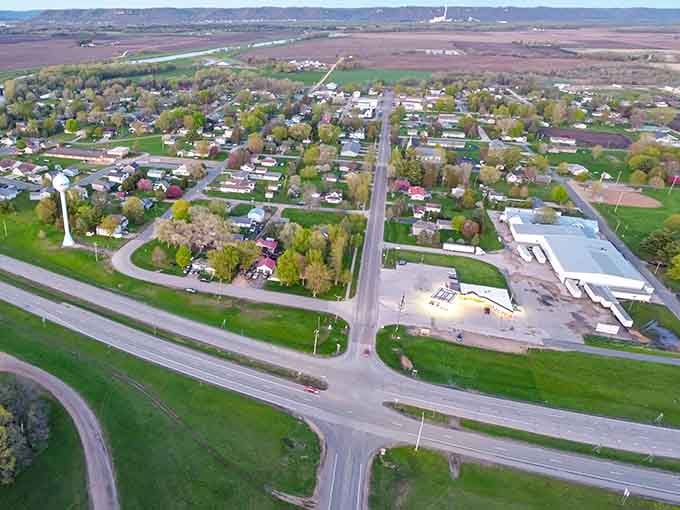 From above, green fields embrace this little town like nature's own protective hug against modern chaos.