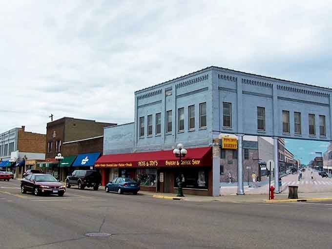 That pale blue corner building stands like a proud sentinel, watching over Main Street's timeless parade of life.