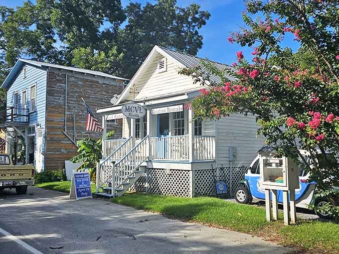 Charming cottages with white picket fences and blooming crepe myrtles create a scene straight from a Southern Living magazine.