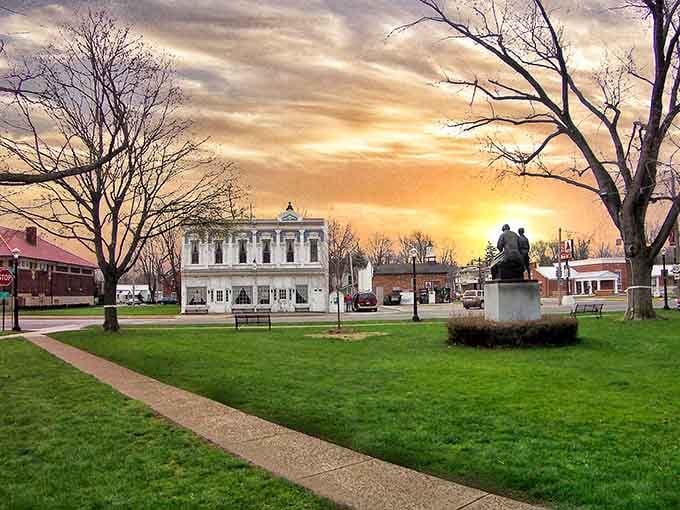 Golden sunset skies paint the town square in magical light, turning an ordinary evening into something worth stopping to photograph and remember.