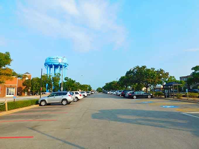 That distinctive blue water tower rises like a lighthouse over wide streets where families stroll without worry.