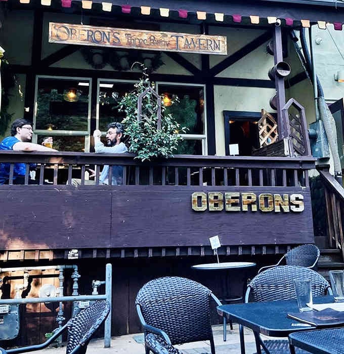 Rustic timber framing and whimsical signage invite guests into a fairy-tale tavern straight from Shakespeare's enchanted forest dreams.