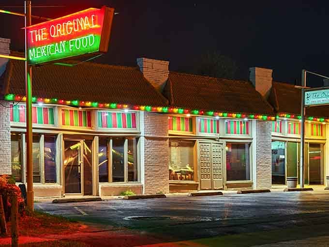 The colorful neon glow at night transforms this classic building into a festive beacon of authentic Mexican flavors.