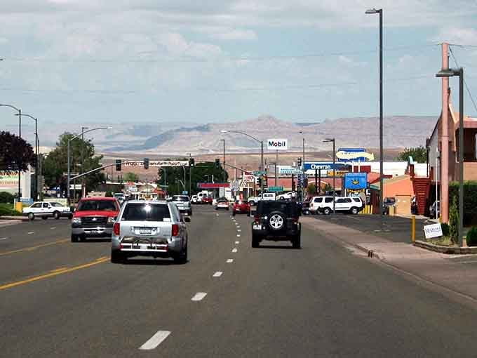 Mountains frame this main street like a natural movie backdrop, proving Arizona towns know how to make an entrance.