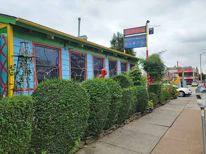 That wildly colorful exterior covered in whimsical art makes you grin before you even taste the food.
