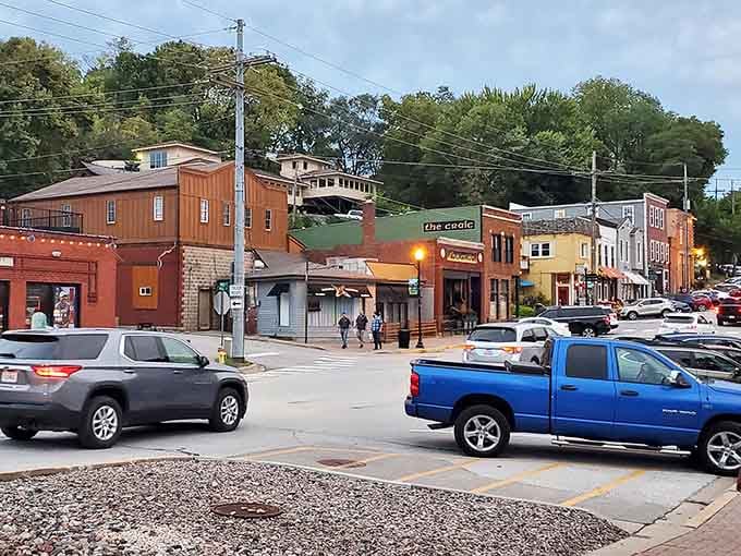 Evening lights glow on Parkville's hillside streets where shops and cafes create a scene worth savoring slowly.