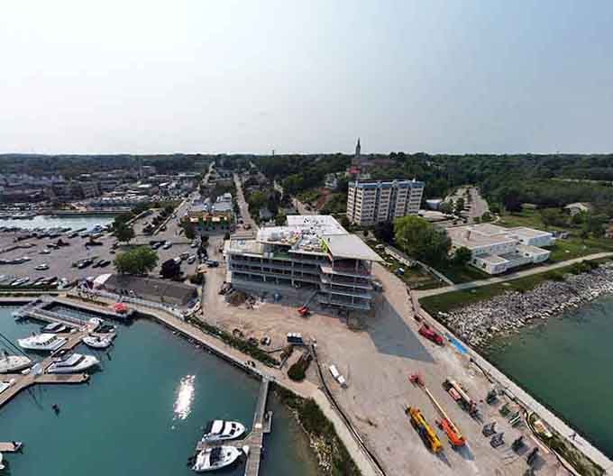That church steeple rising above the street creates a skyline that's been guiding people home for generations.