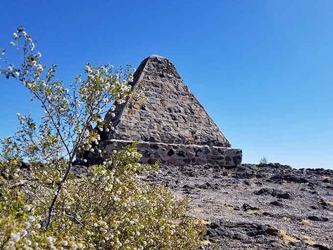 Nature carved this dark volcanic pyramid rising from the desert floor over millions of patient, windswept years.