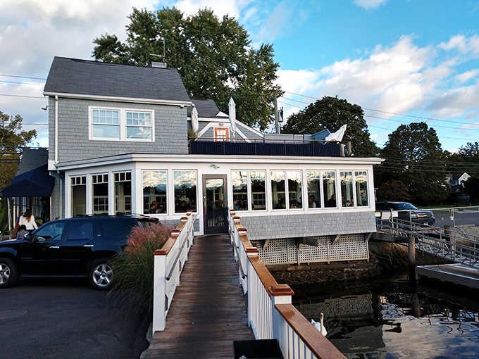 Nautical charm meets marina views at this blue-trimmed beauty, where the landscaping is as lovely as the location.