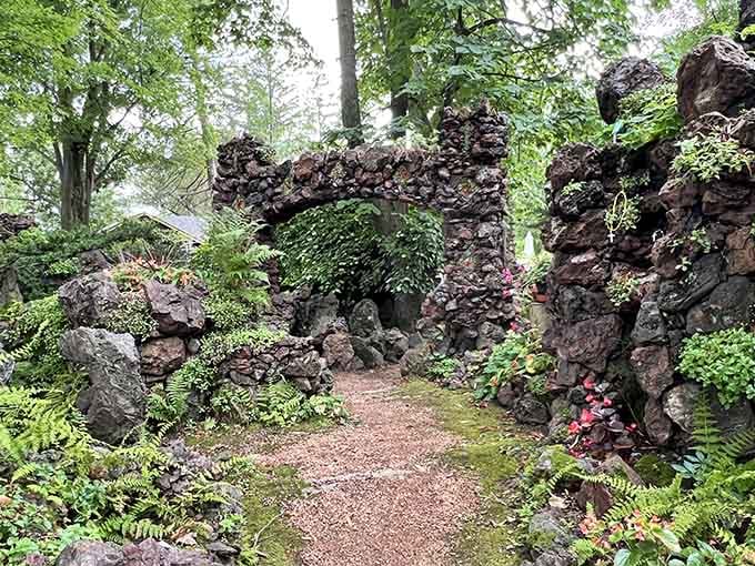 Moss-covered stone pathways wind through peaceful grottos where nature and handcrafted artistry blend in perfect harmony.