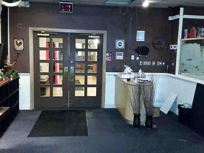 Step inside where rustic Western decor meets serious smoking equipment, creating an atmosphere that's both cozy and authentically carnivorous.