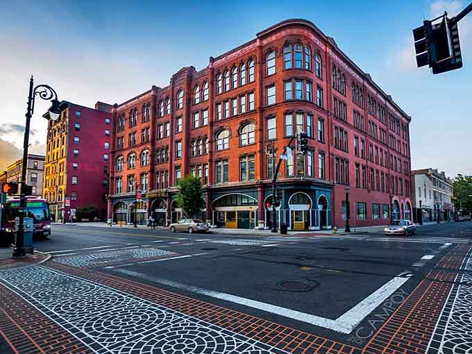 Brick buildings stand shoulder-to-shoulder downtown, their windows reflecting clouds drifting lazily across perfect autumn skies.