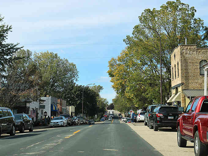 Tree-lined streets invite leisurely strolls past historic buildings where time moves slower and neighbors still know each other's names perfectly.