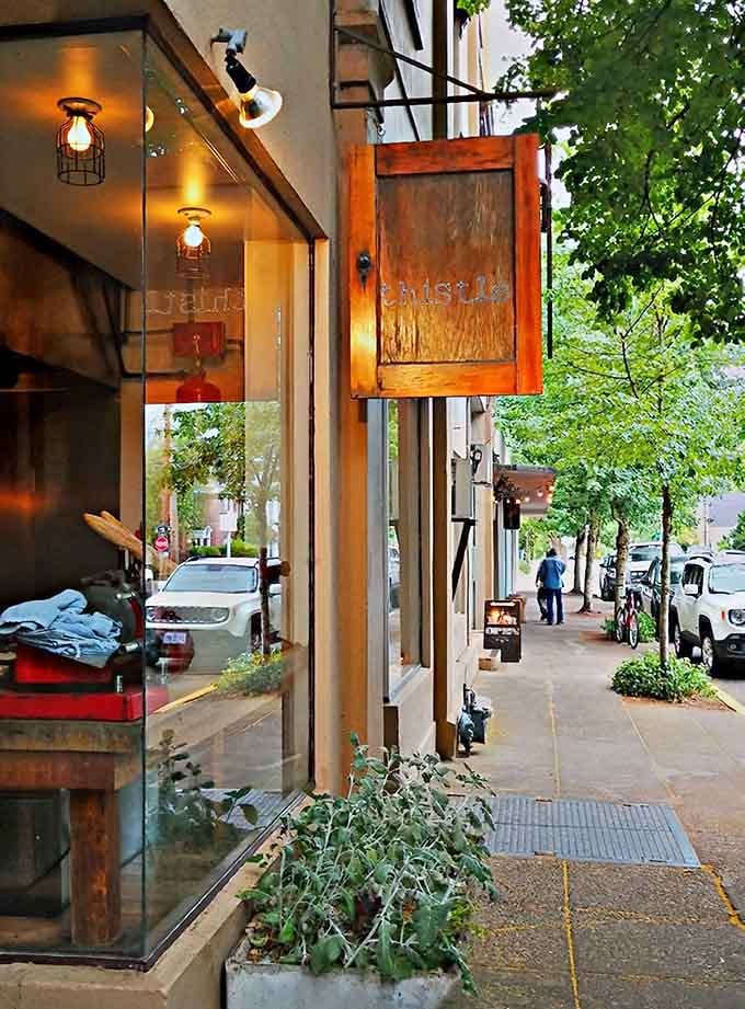 Industrial-chic lighting and rustic wood details create an atmosphere where wine country meets urban cool on every corner.