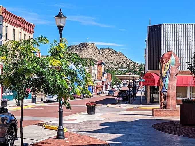 Downtown Trinidad's brick streets and historic storefronts create a postcard-perfect scene with mountains providing the dramatic backdrop.