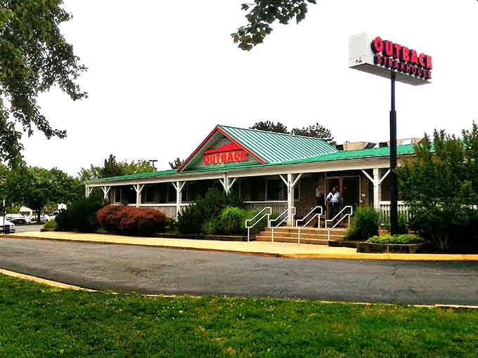 That green metal roof and front porch welcome hungry travelers like a beacon of comfort food and good times ahead.