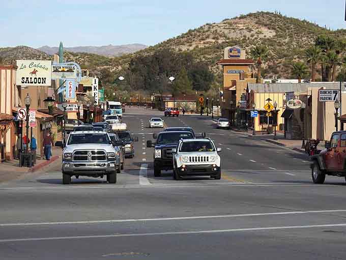 Wooden storefronts and saguaro-dotted hills blend cowboy heritage with natural beauty in perfect Western harmony.