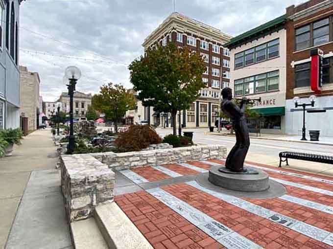 Public art and brick plazas create gathering spots where community happens naturally, not through expensive membership fees required.