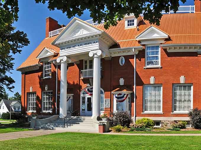 Grand columns frame the entrance to this public museum like a Greek temple dedicated to preserving local stories and treasures.