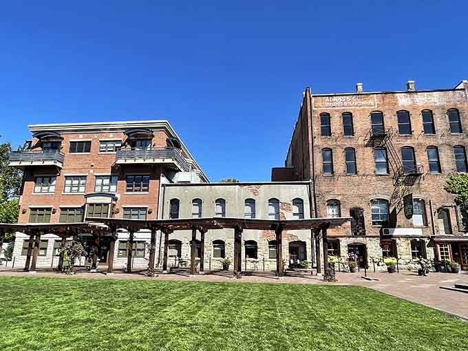 Bellingham's historic brick facades stand proud under blue skies, their green lawn plaza inviting you to rest weary feet.