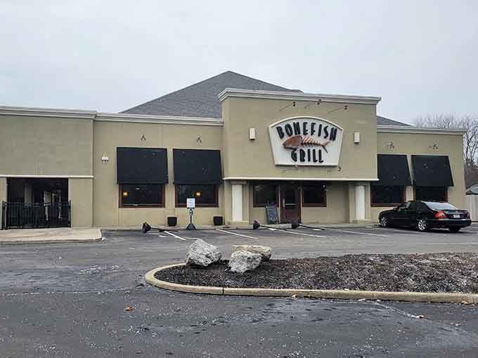 Winter-bare trees frame this inviting spot where wood-grilled fish and famous shrimp await your eager appetite.