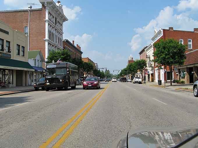 Tree-lined main street stretches toward the horizon, inviting leisurely drives through a town that values its past.