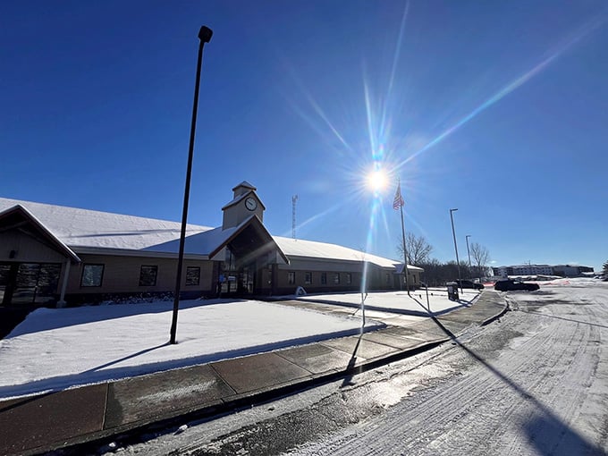 Winter sunshine bathes this peaceful scene where fresh snow and clear skies promise another safe, quiet day.