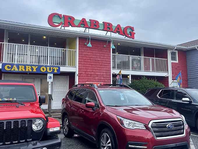 Those colorful balconies overlooking the parking lot hint at the lively atmosphere waiting inside this coastal gem.