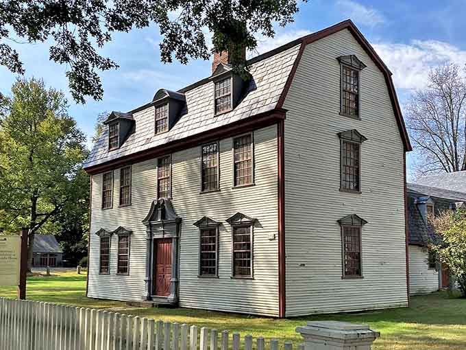 Colonial architecture at its finest, with those distinctive dormer windows watching over the green like they have for generations.