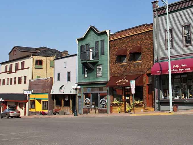 Buildings painted like a rainbow line up cheerfully, each color telling its own story of heritage.