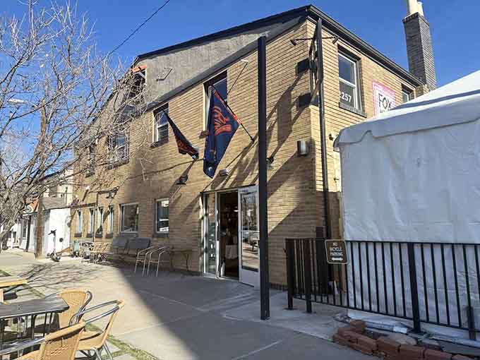 Winter sunlight dances across this charming brick facade, where weekend brunch dreams become delicious reality every single day.