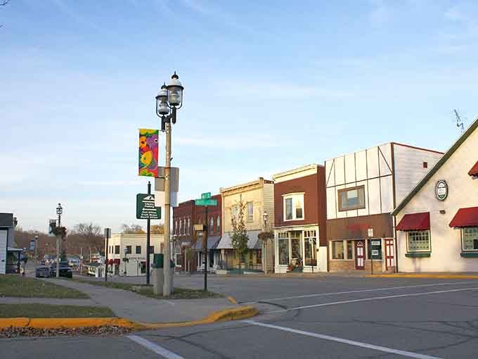 Colorful banners and well-kept storefronts show a community that takes pride in welcoming both neighbors and visitors with equal warmth.