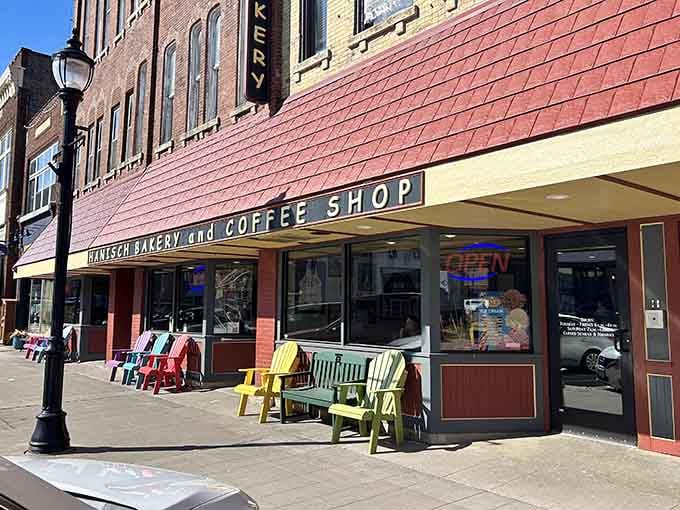 Those rainbow Adirondack chairs on the sidewalk promise that this bakery knows how to make people smile daily.