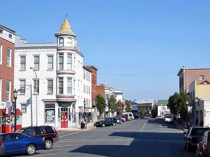 That distinctive corner turret building commands attention like a Victorian-era architectural exclamation point on the streetscape.